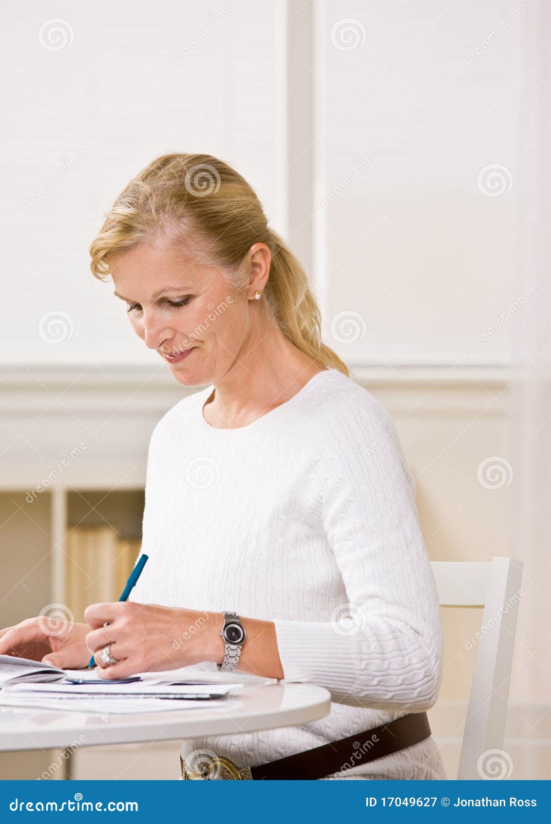 Woman writing checks stock image. Image of female, domestic - 17049627