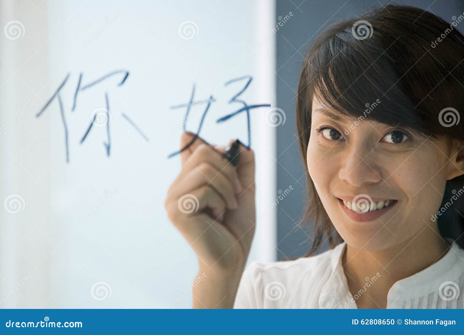 Woman Writing Hello in Chinese Stock Photo - Image of business ...