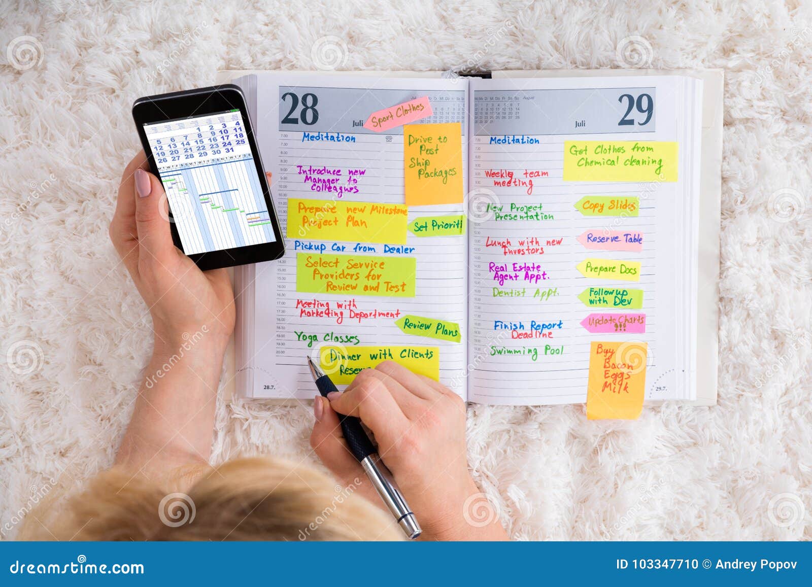 Woman Writing Note in Diary Using Mobilephone Stock Photo - Image of ...