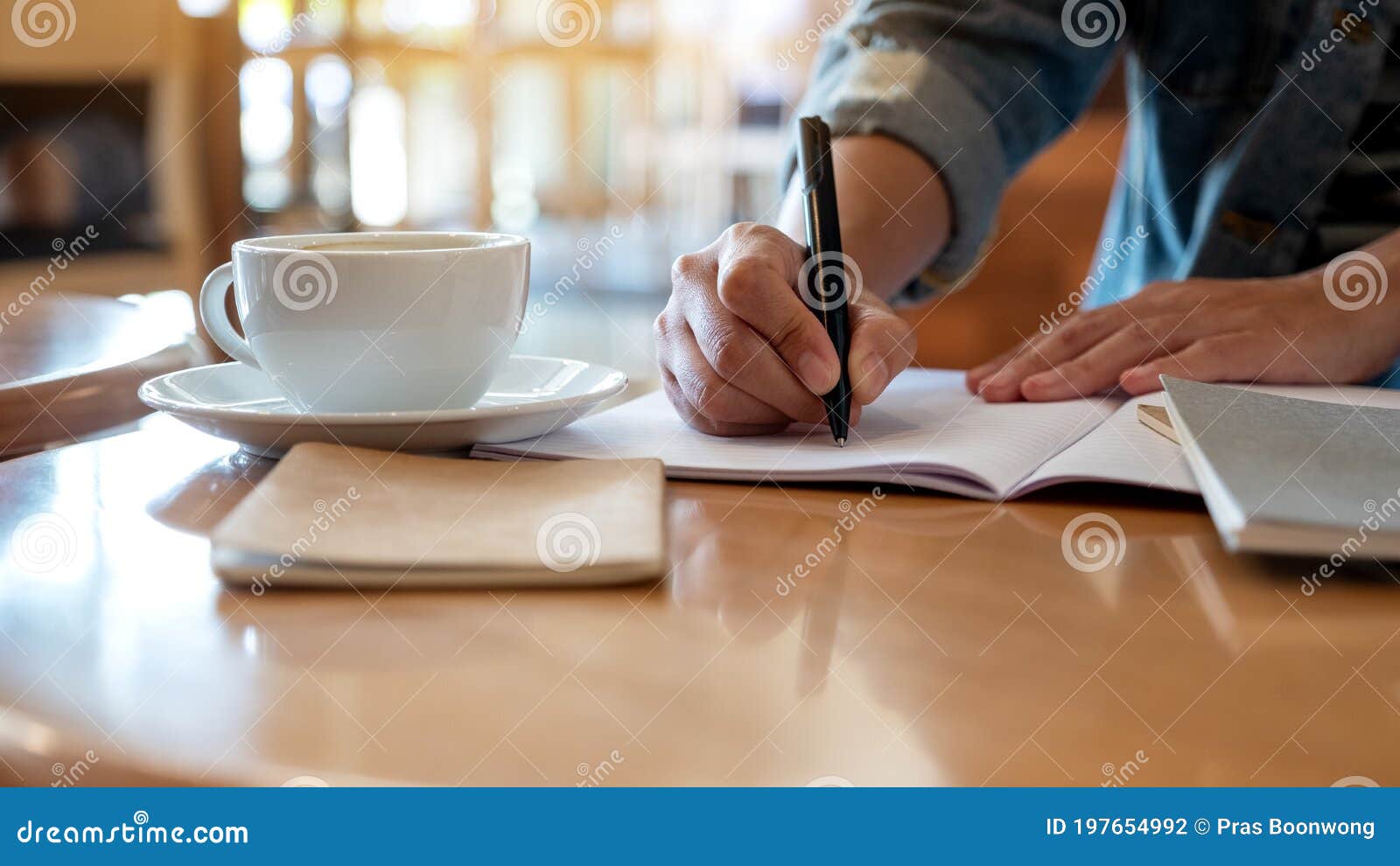 A Woman Writing on a Notebook on the Table Stock Photo - Image of ...