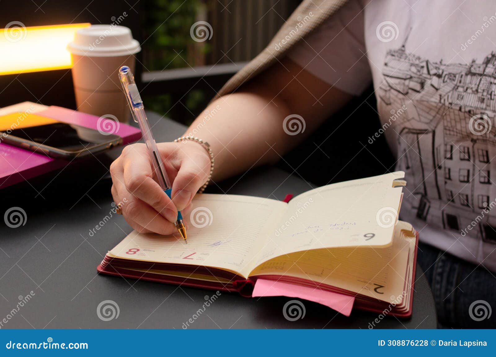 Woman Writing in Notebook at the Table Stock Photo - Image of study ...