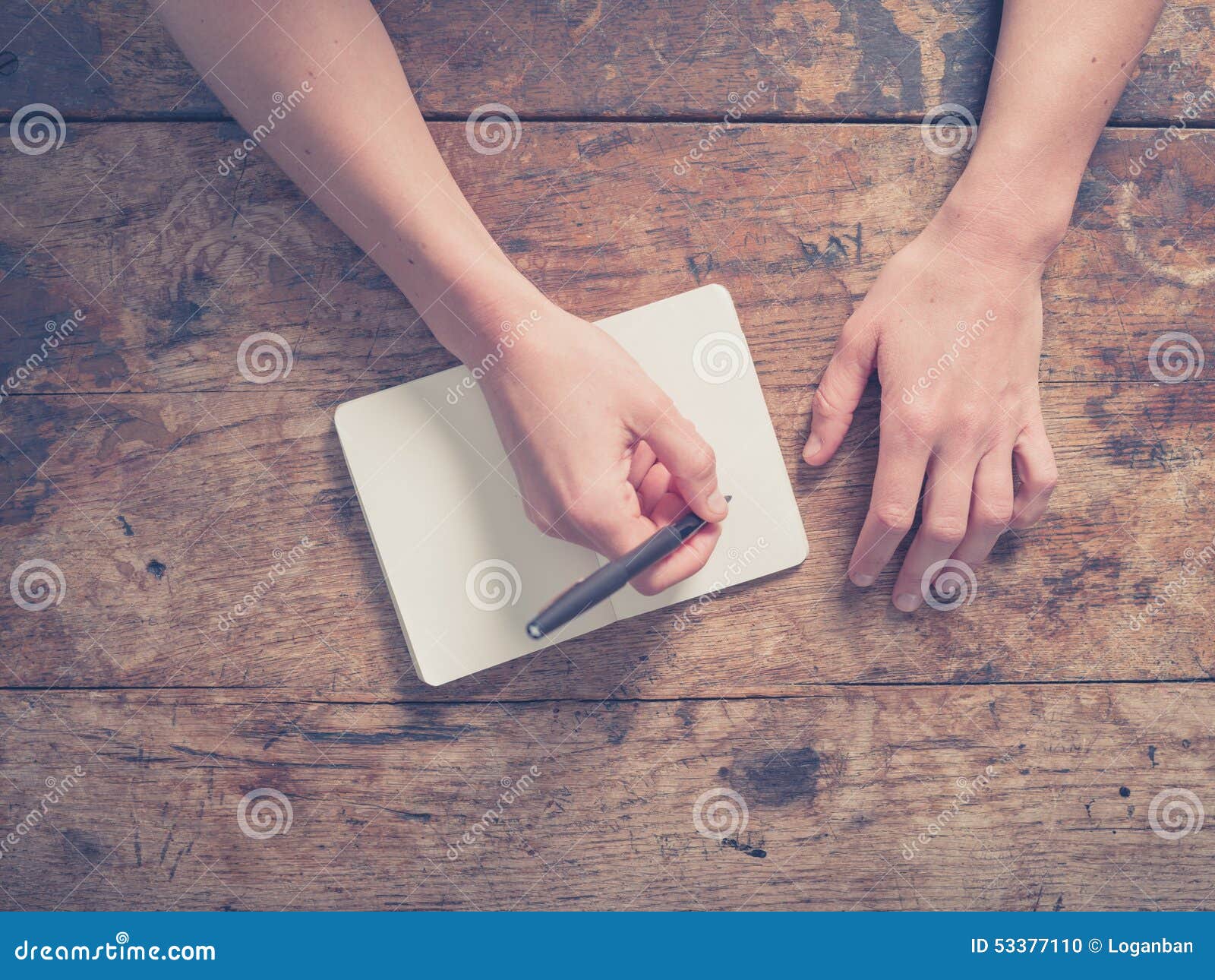 Woman Writing in Notepad at Wooden Table Stock Photo - Image of table ...