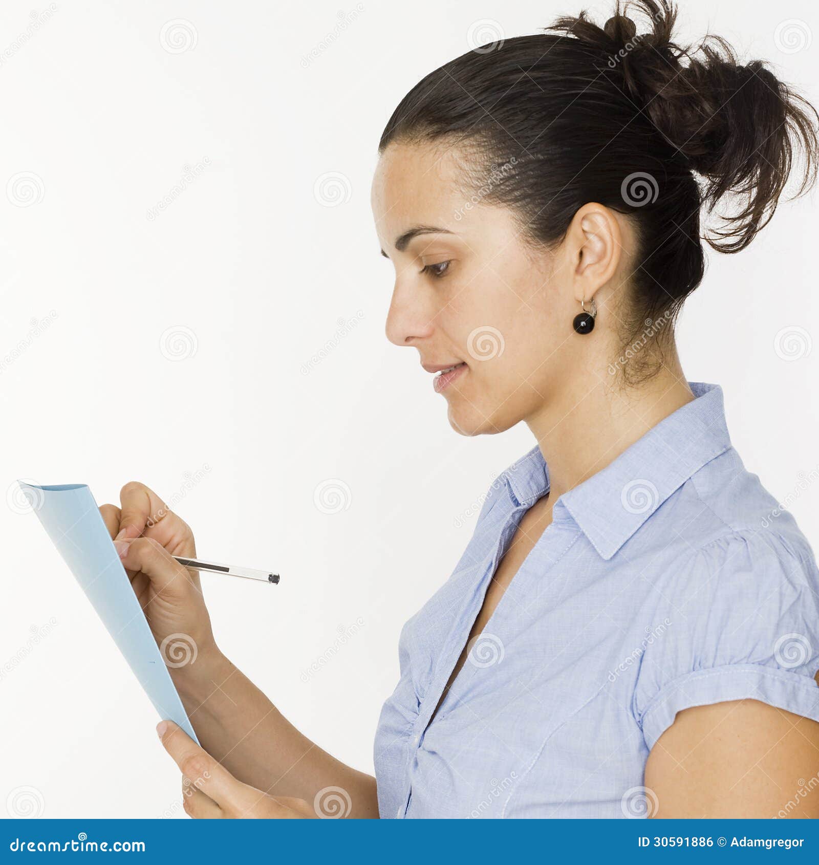 Woman writing on a paper stock photo. Image of looking - 30591886