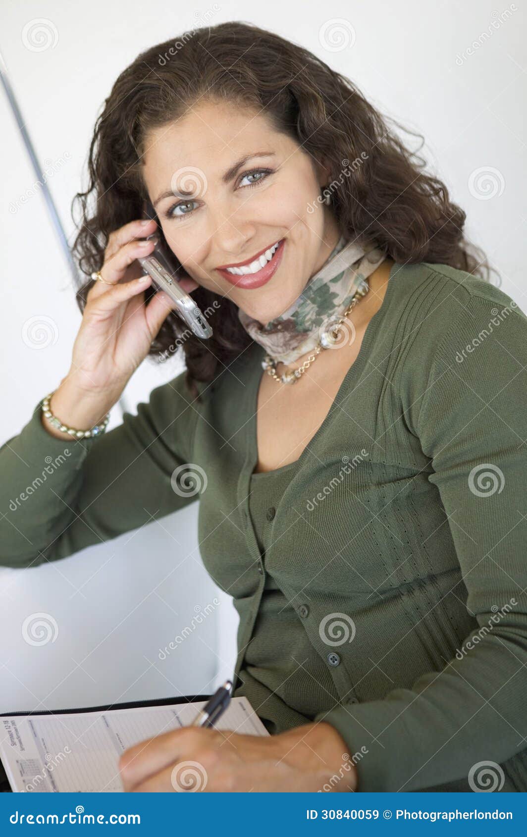 Woman Writing and Using Cell Phone Portrait Stock Image - Image of hair ...