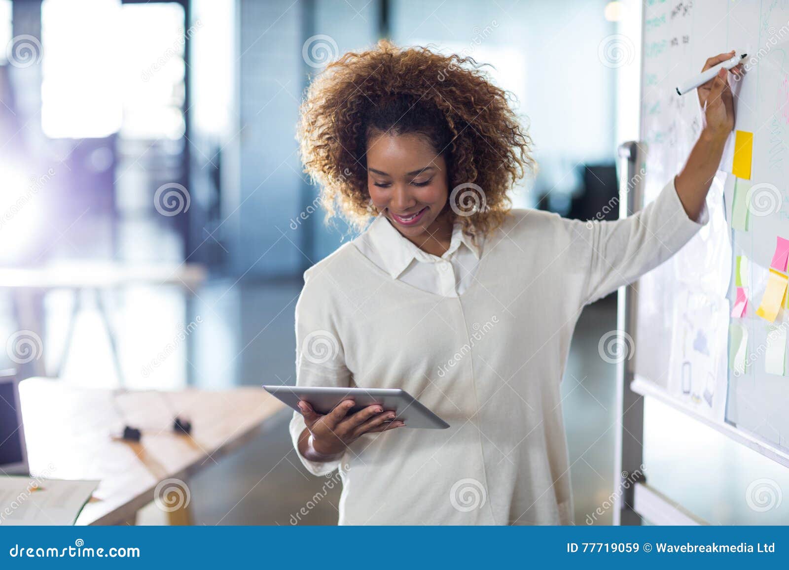 Woman Writing on Whiteboard while Holding Digital Tablet Stock Image ...