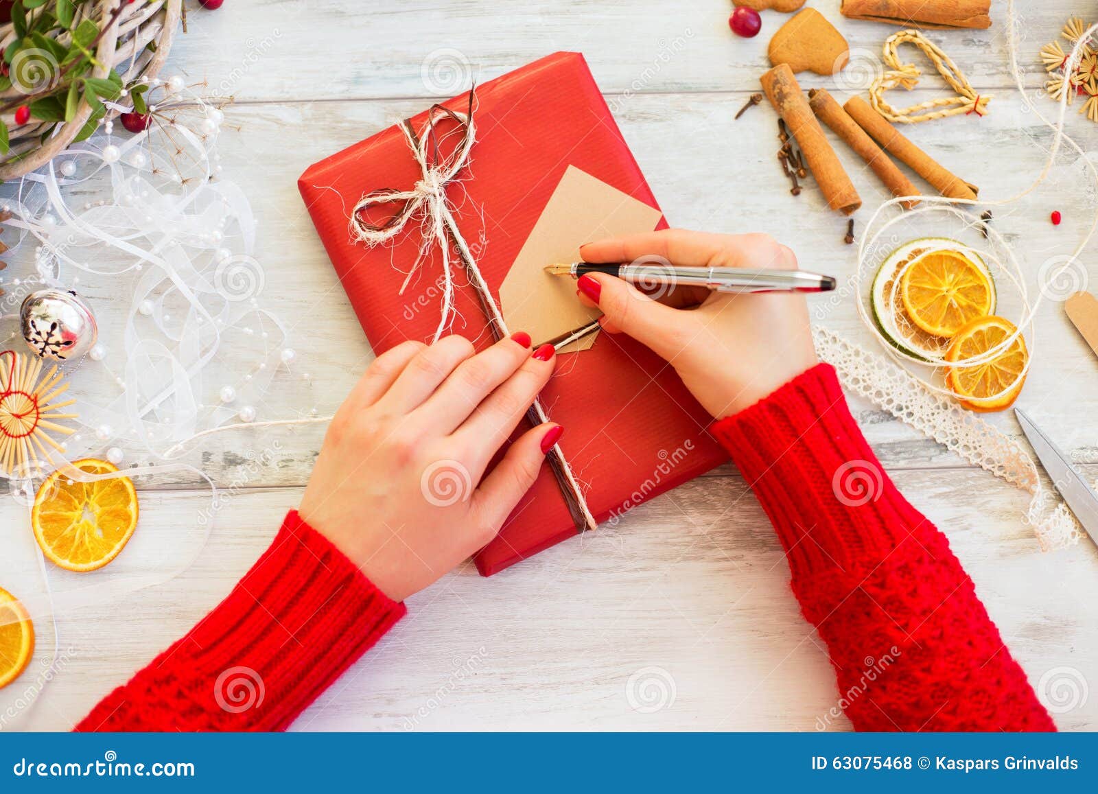 Woman Writing on Wrapped Present Stock Photo - Image of desk, modern ...