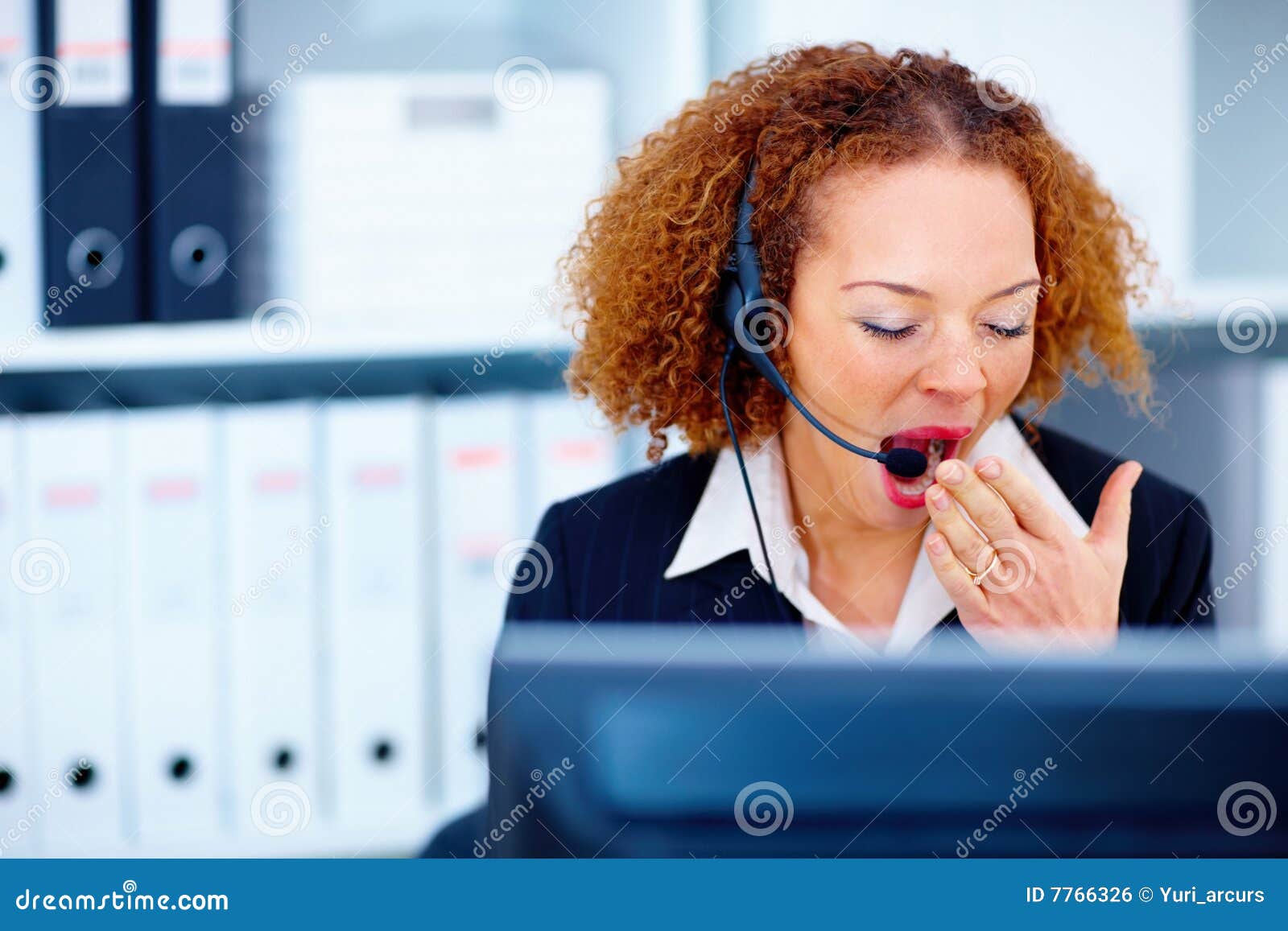 Woman Yawning while Using Headset in Office Stock Photo - Image of ...