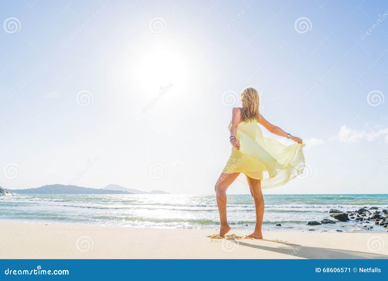 Woman in Yellow Dress on the Beach Stock Image - Image of landscape ...