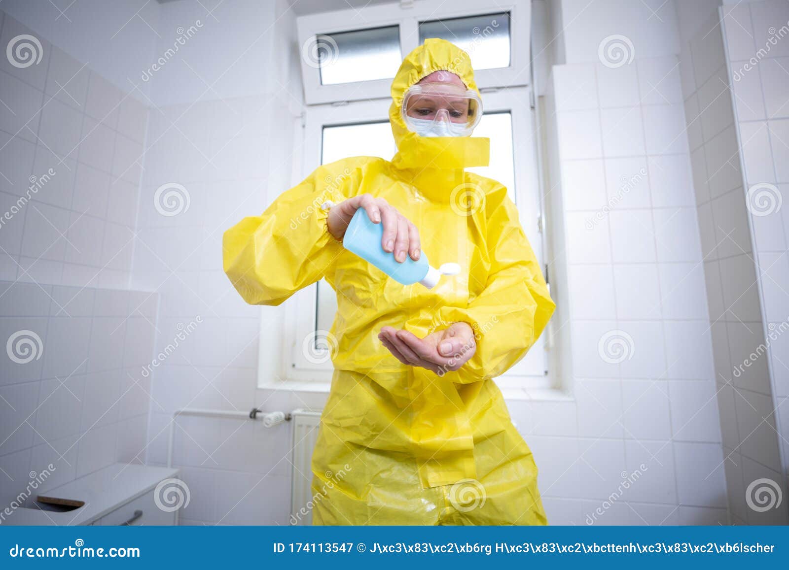 Woman in a Yellow Full Protected Suit with Disinfectant Stock Image ...