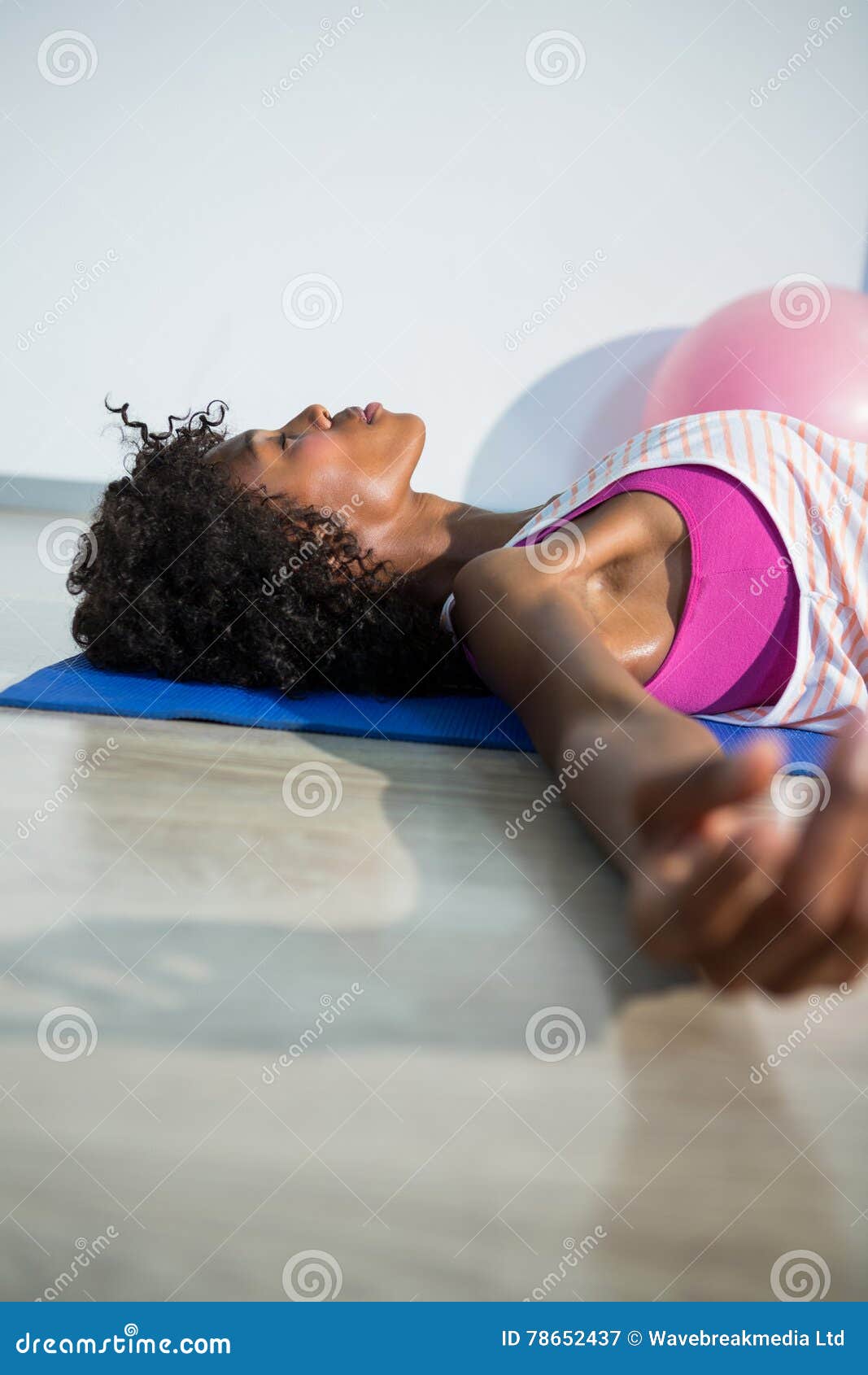 Woman in yoga corpse pose stock image. Image of corpse - 78652437