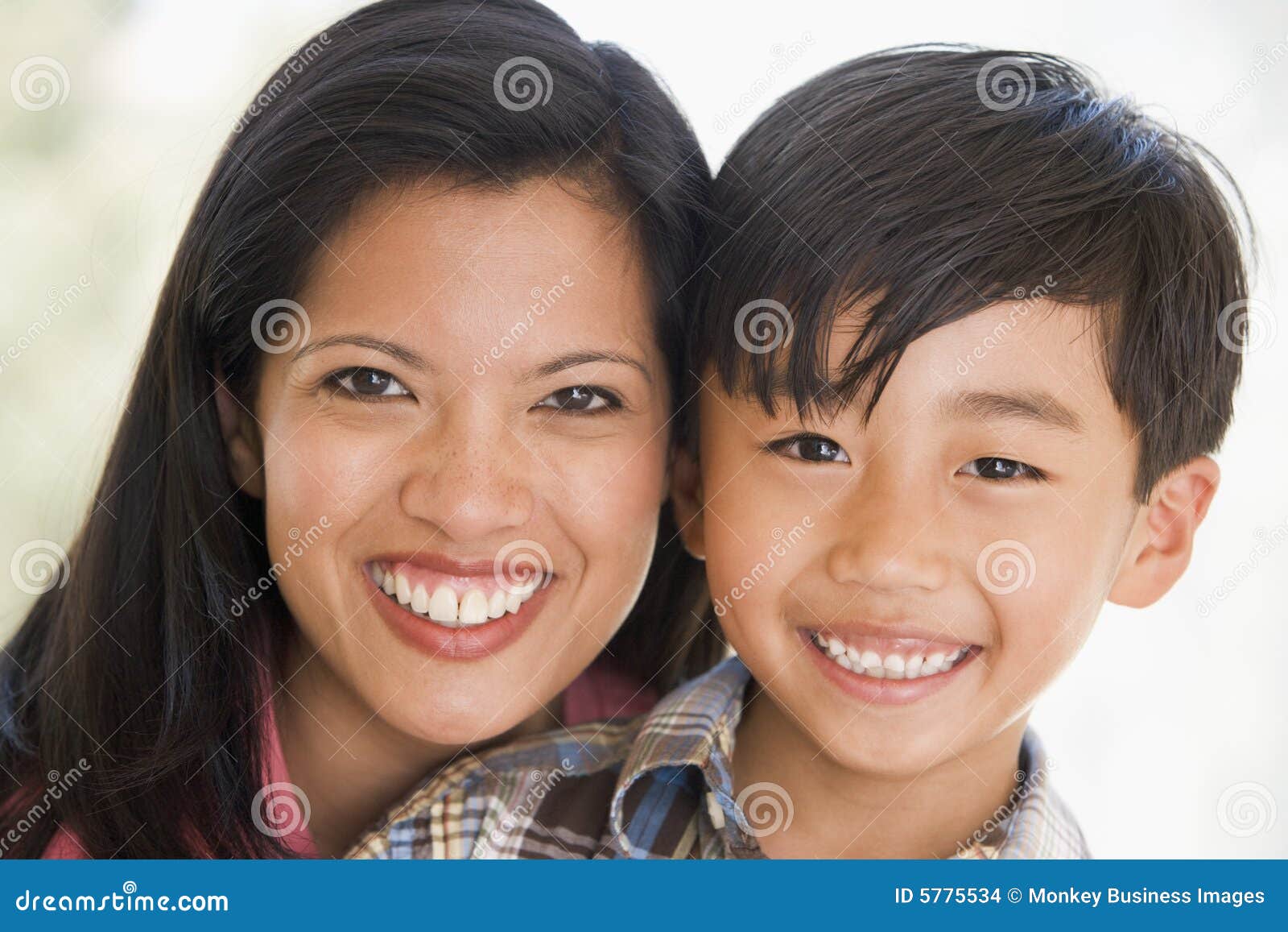 Woman and Young Boy Smiling Stock Photo - Image of indoors, enjoying ...