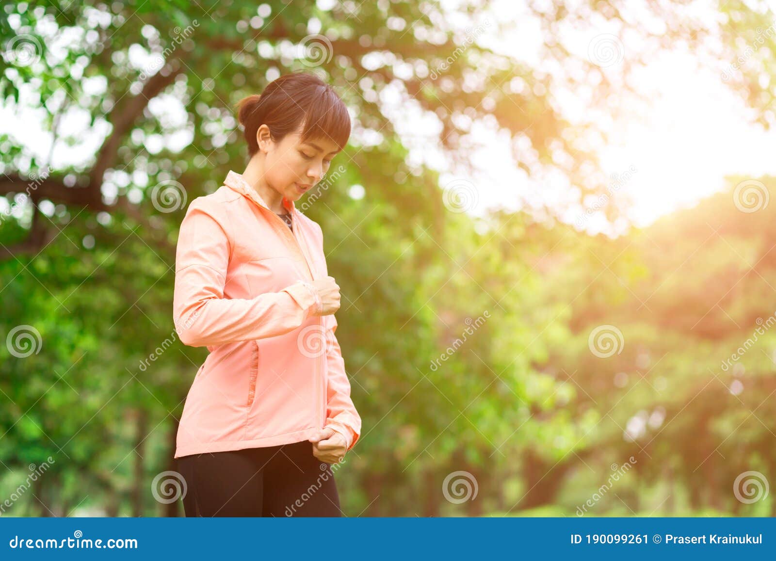 Woman Zipping Zip Up before Excercise Stock Image - Image of excercise ...
