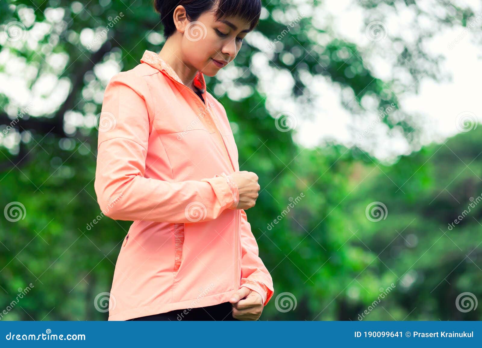 Woman Zipping Zip Up before Excercise Stock Image - Image of person ...