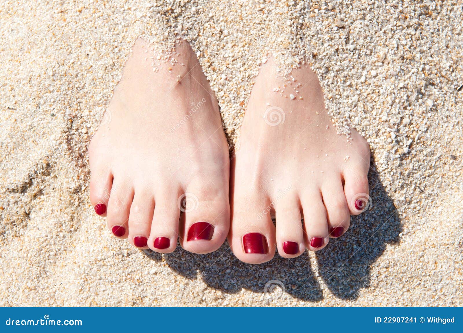 Womans Feet In Sand Stock Image - Image: 22907241