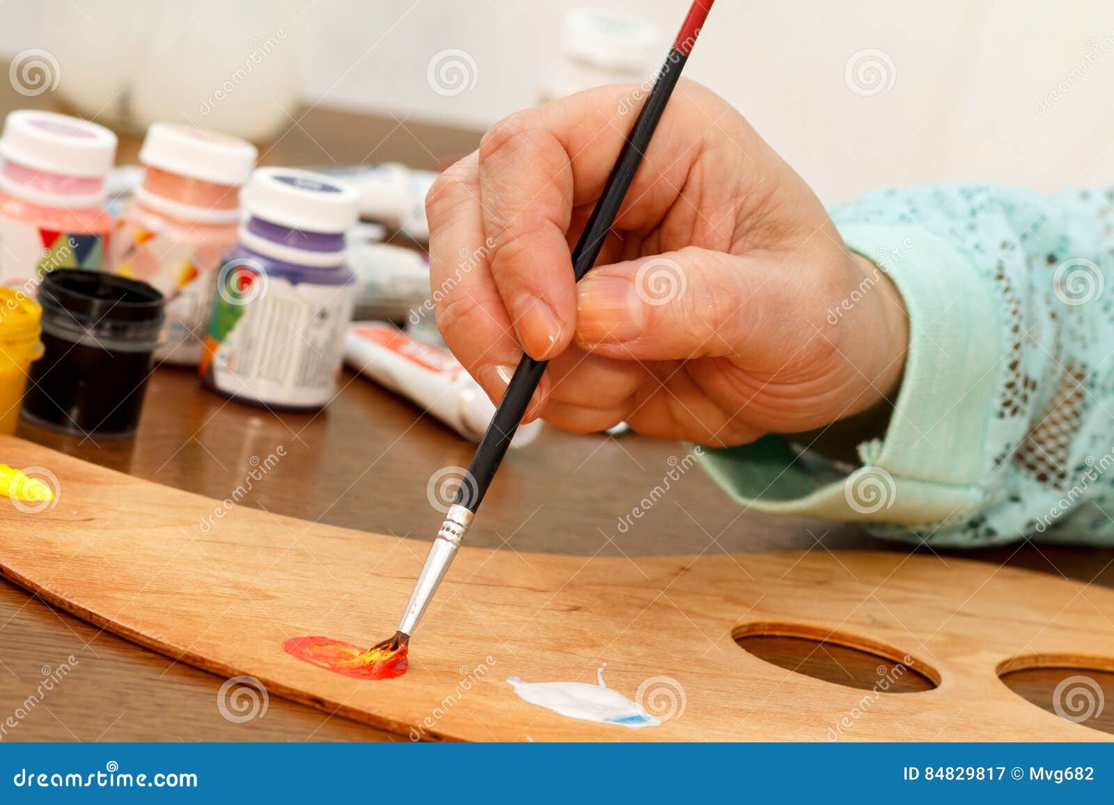A Womans Hand Mixing Paints on the Palette Stock Image - Image of idea ...
