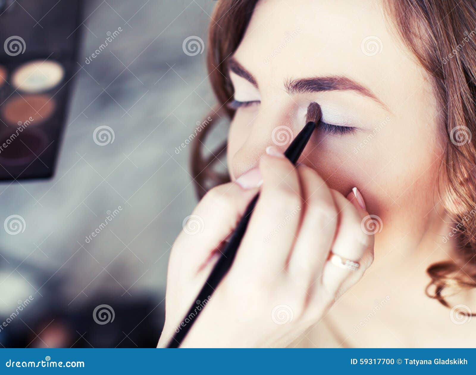 Women applying makeup stock photo. Image of cosmetics - 59317700