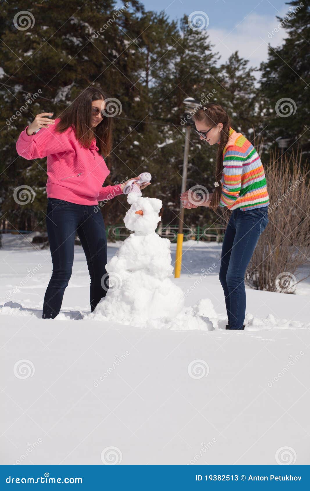 Women building snowman stock image. Image of happiness - 19382513