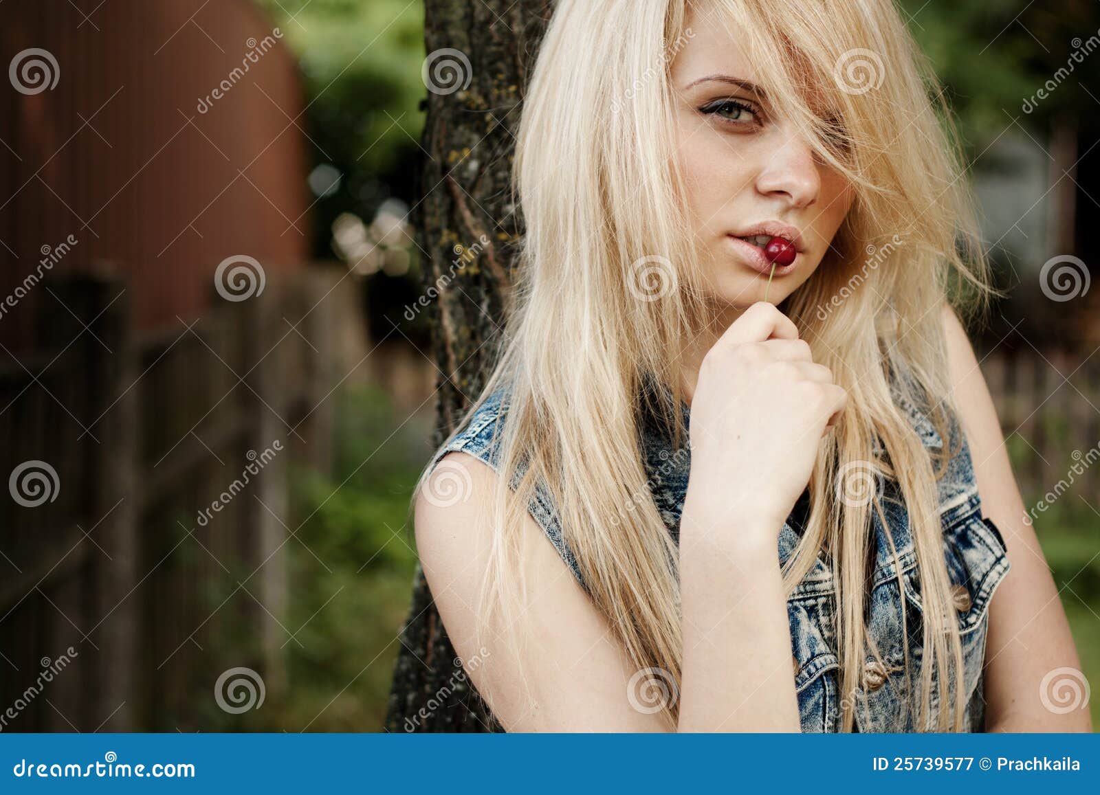 Women with cherry stock image. Image of gourmet, hair - 25739577