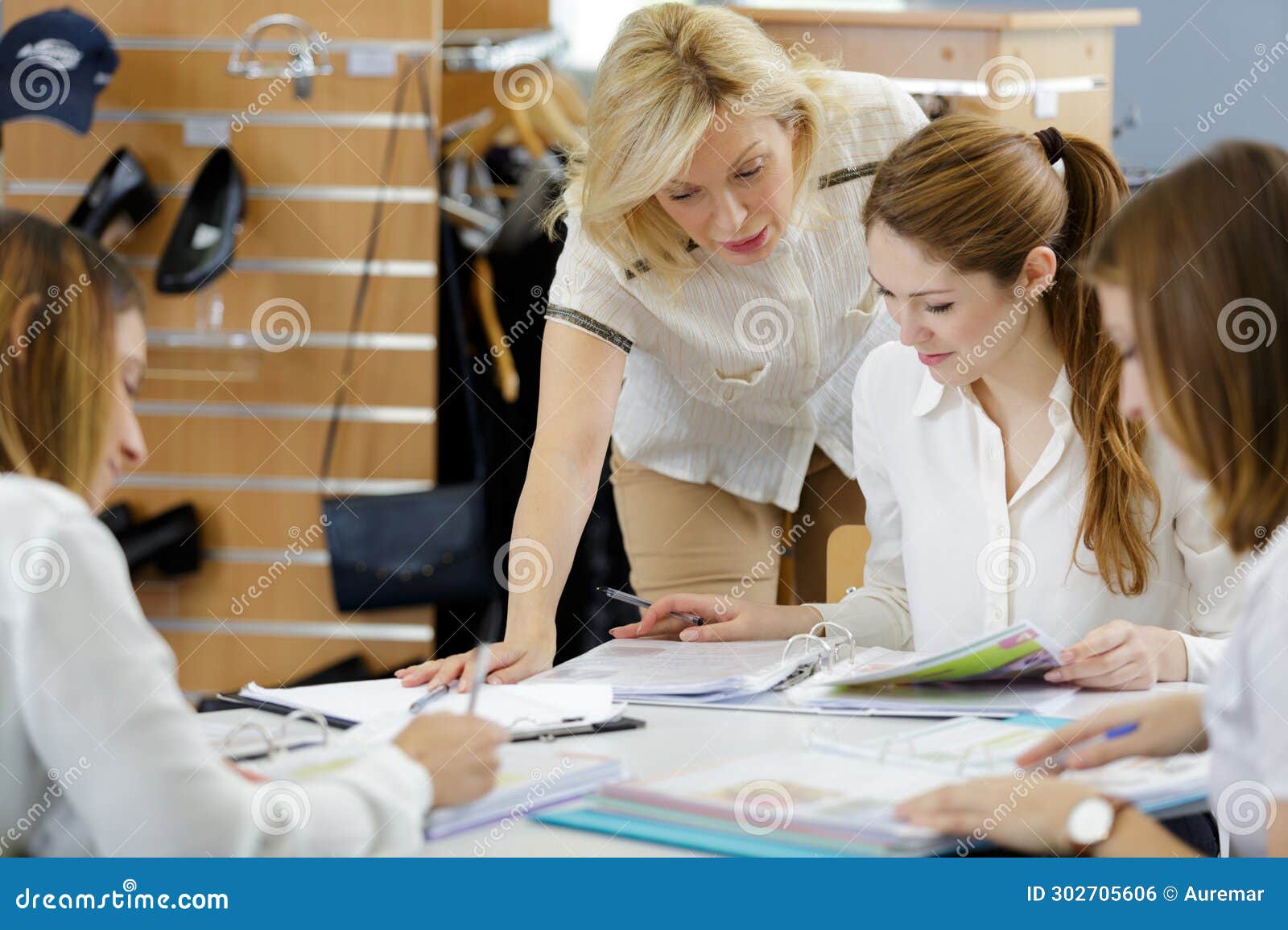 4 women in classroom stock photo. Image of welldressed - 302705606