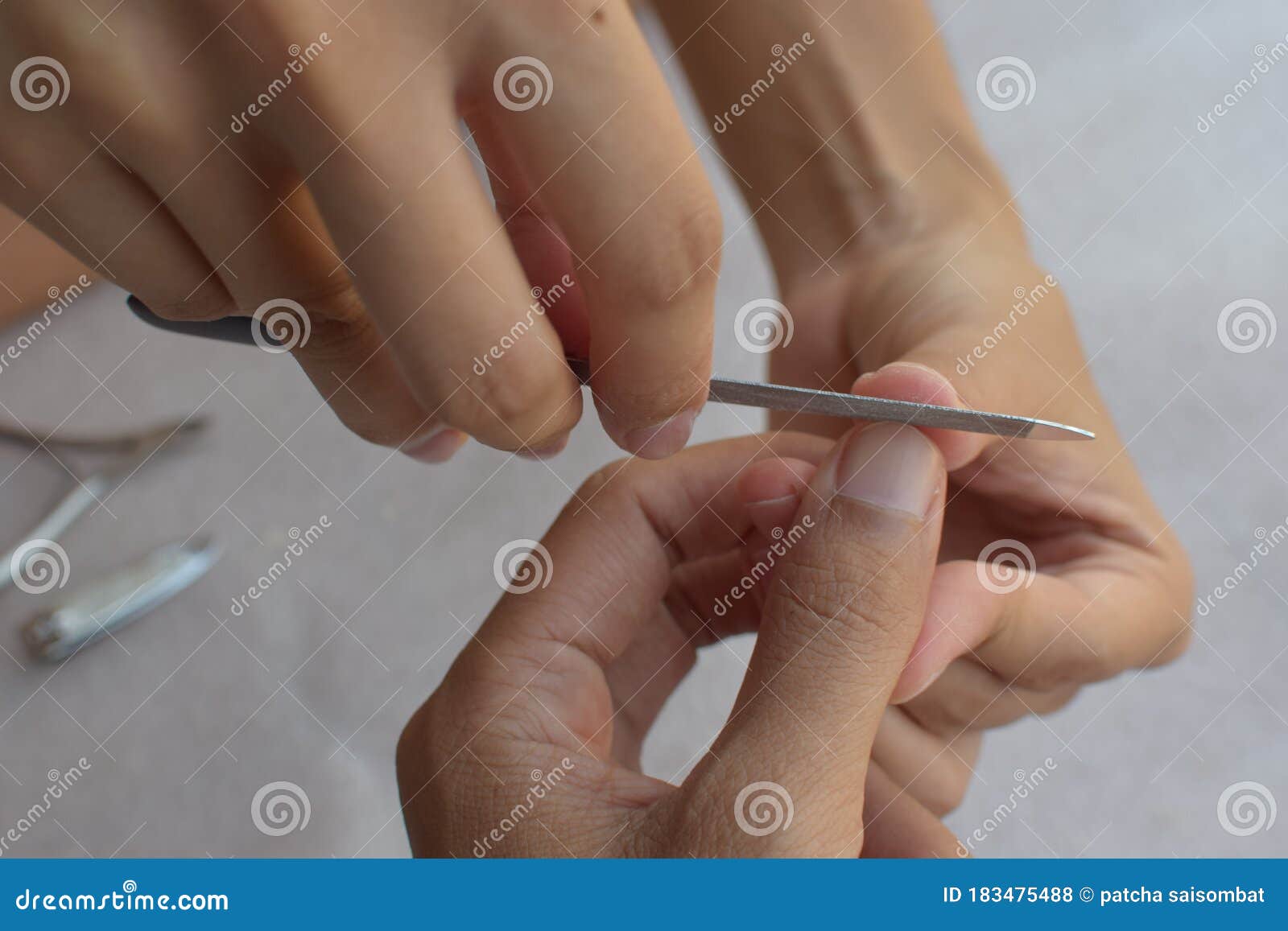 Women Clean Their Fingernails with a Nail File. Stock Photo - Image of ...