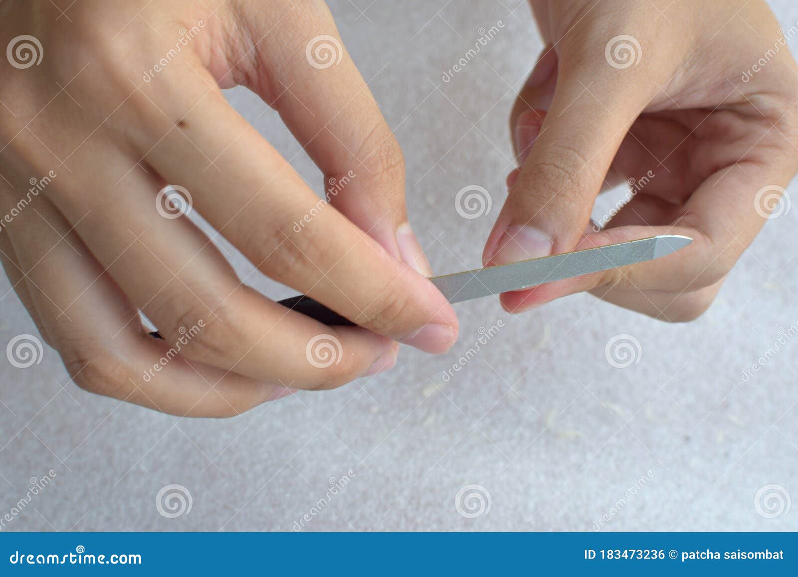 Women Clean Their Fingernails with a Nail File. Stock Photo - Image of ...