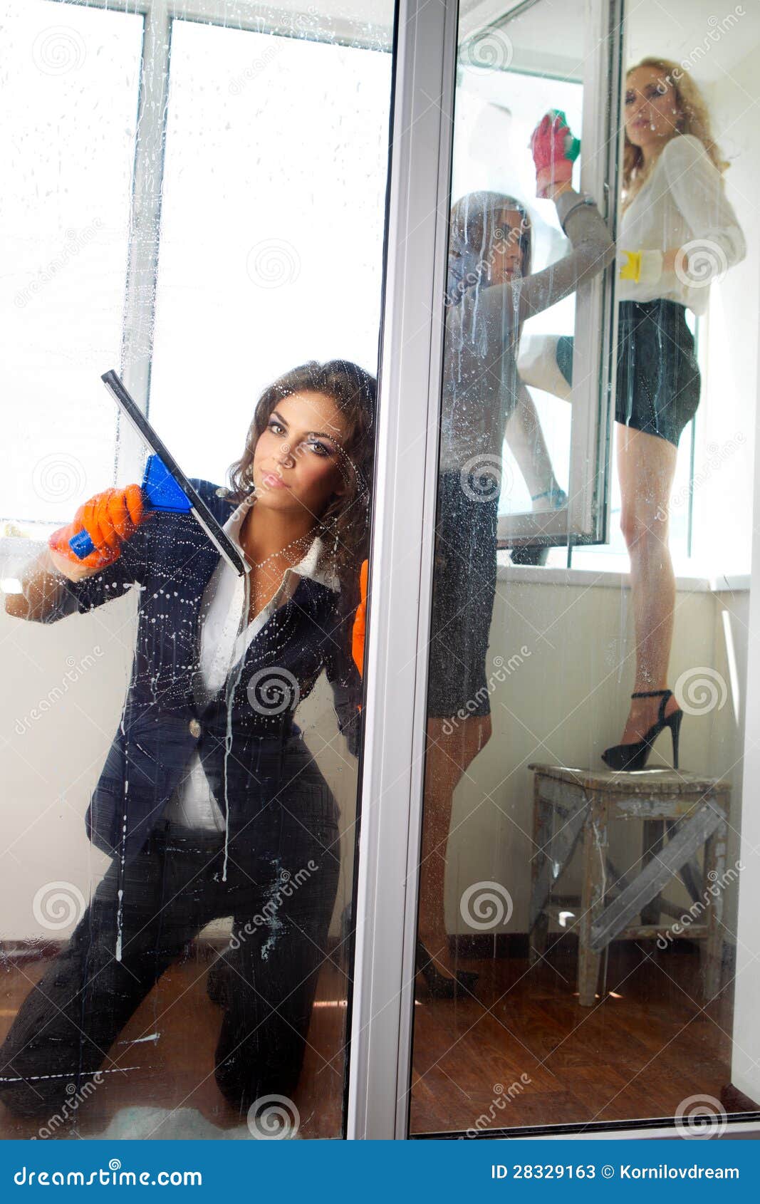 Women cleaning her windows stock image. Image of female - 28329163
