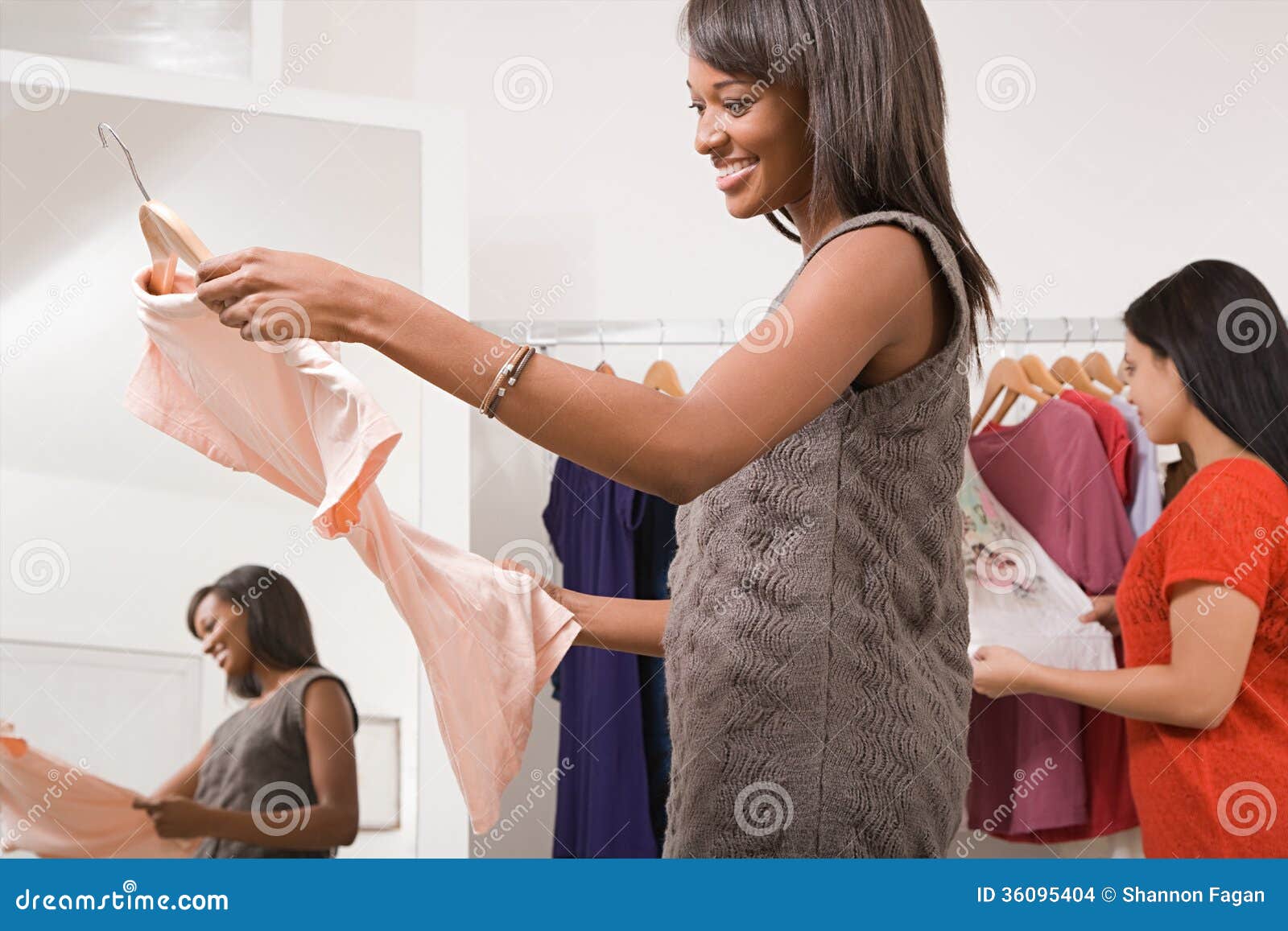Women in clothes shop stock photo. Image of biracial - 36095404