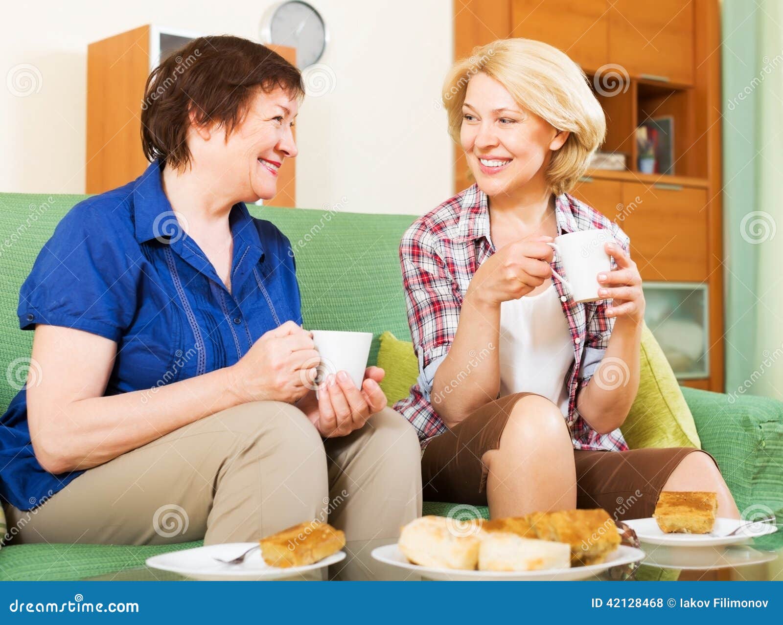 Women Colleagues Drinking Tea and Talking during C Stock Photo - Image ...