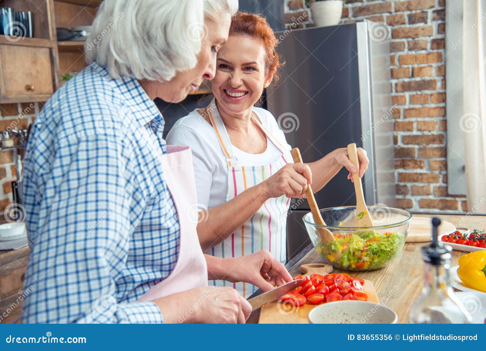 Women cooking together stock photo. Image of parenting - 83655356