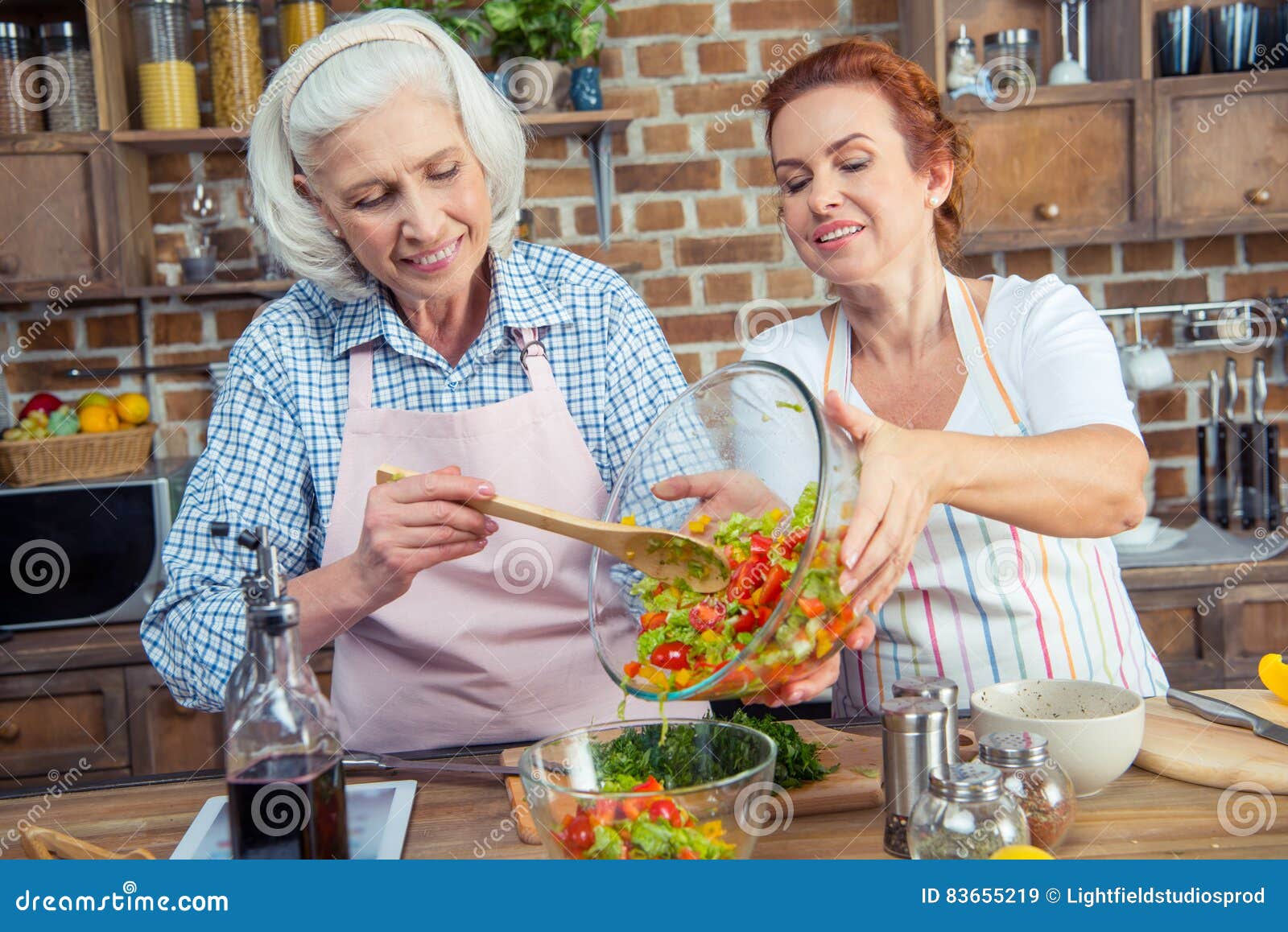 Women cooking together stock image. Image of closeness - 83655219