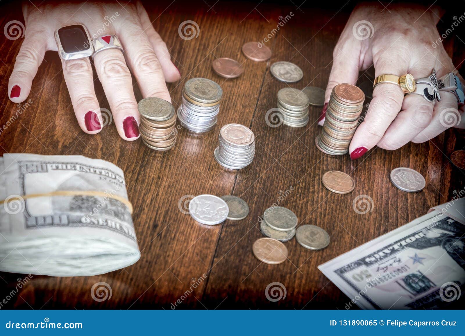 Women Counting Banknotes of Dollar and Some Coins on a Table Stock ...