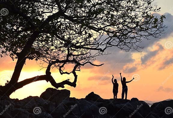 Women Dancing Tree Sunset stock photo. Image of handup - 68388626