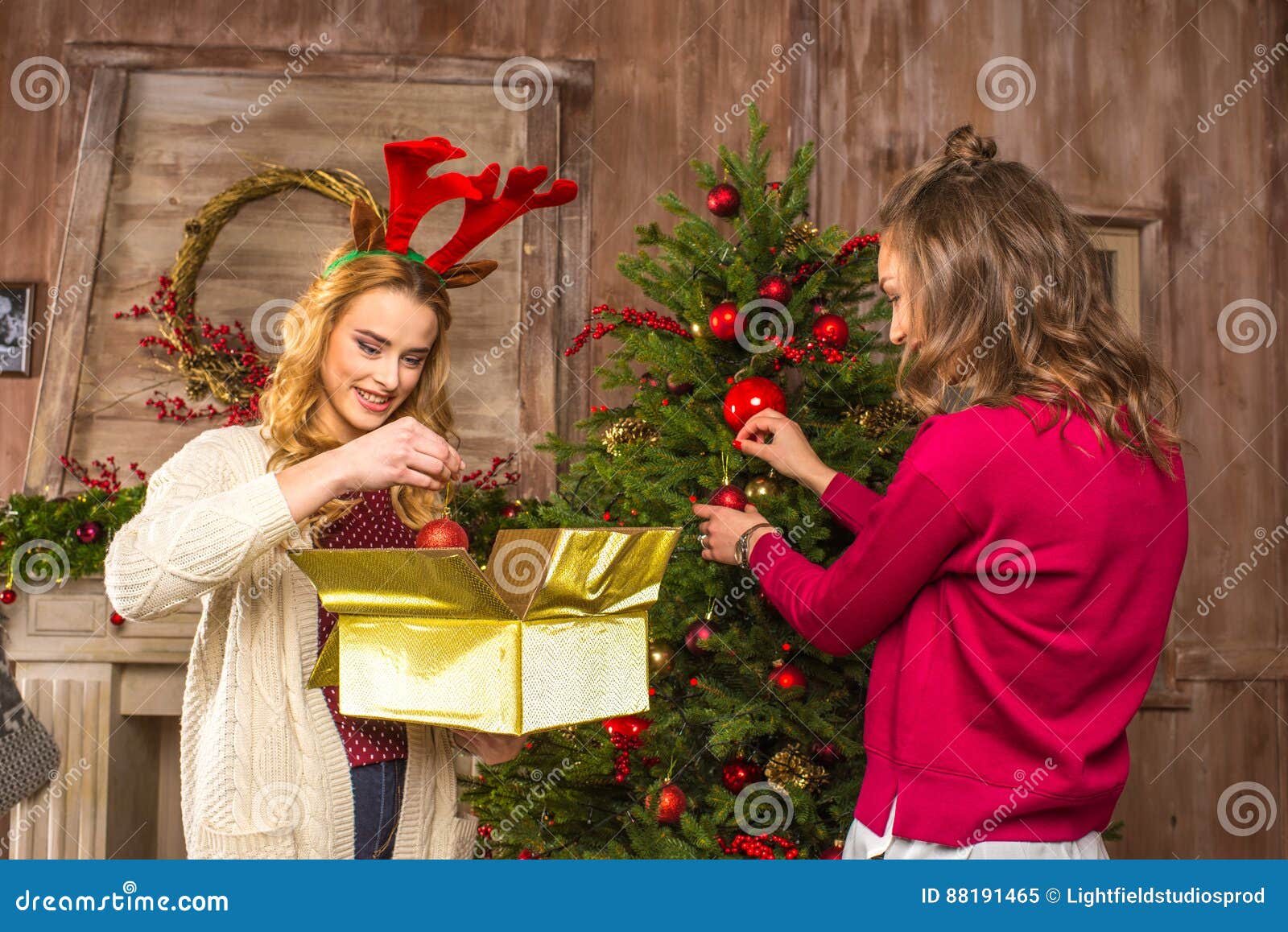 Women Decorating Christmas Tree Stock Image - Image of bonny, female ...