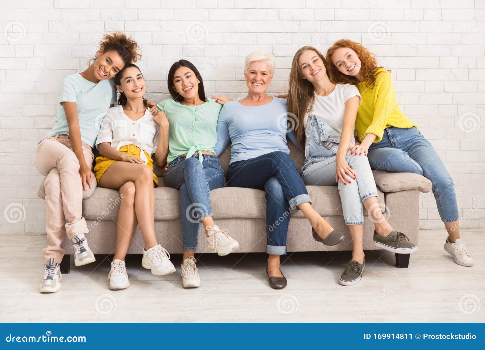 Women of Different Age Sitting on Sofa Smiling Indoor Stock Image ... Women of Different Age Sitting on Sofa Smiling Indoor Stock Image ...