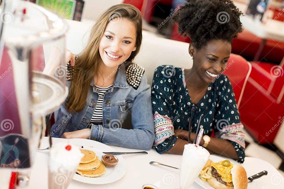 Women in the diner stock photo. Image of hamburger, table - 76693932
