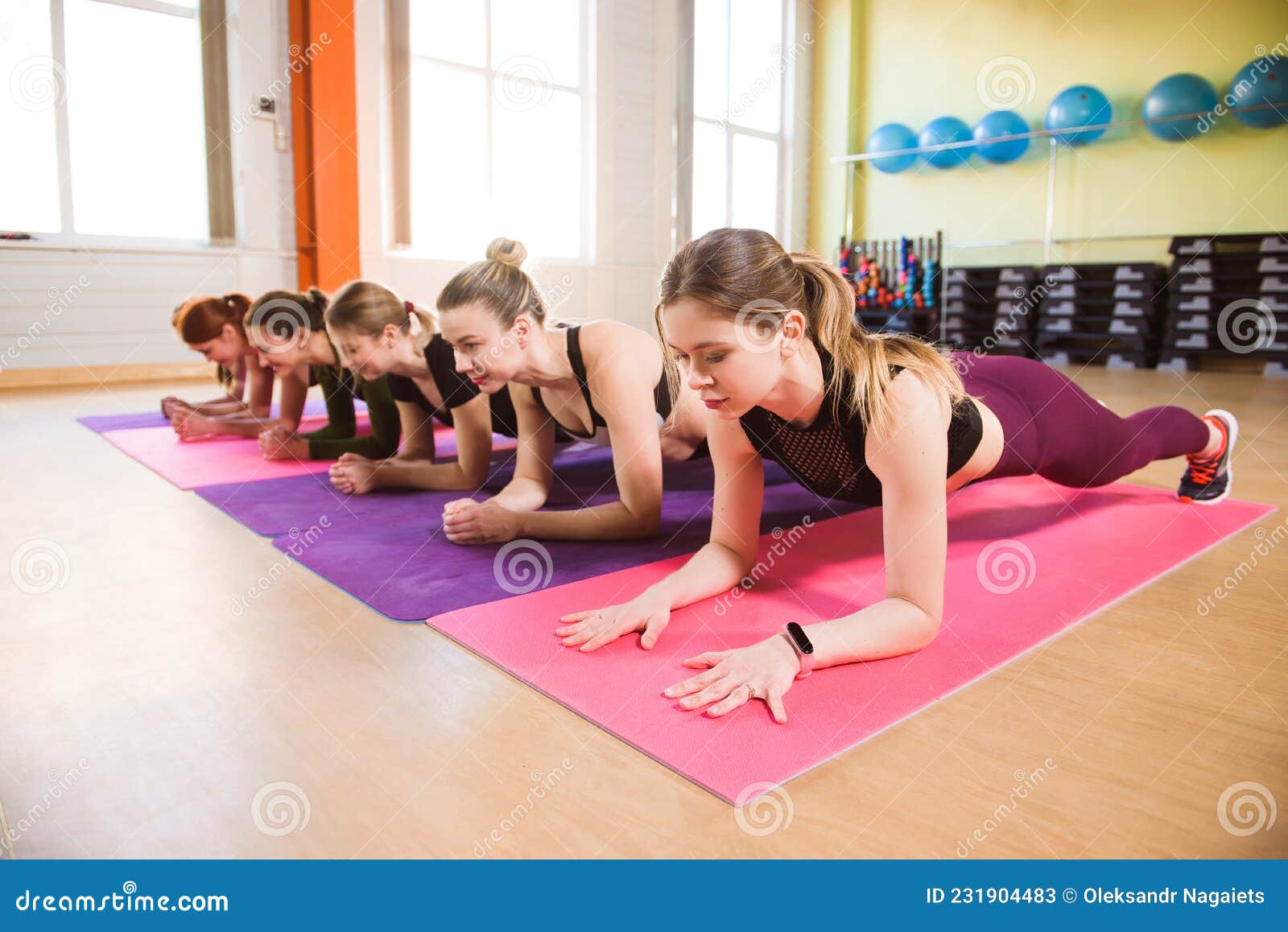 Young Women Doing Exercise for Abdominal. Athletic Class Doing Abs in a ...