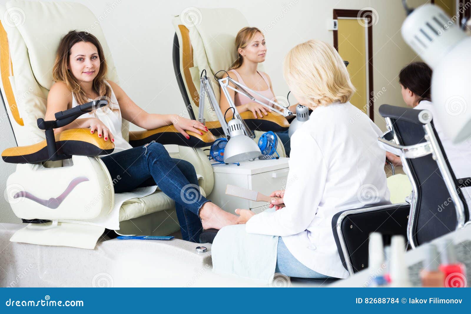 Women doing pedicure stock photo. Image of american, enameling - 82688784