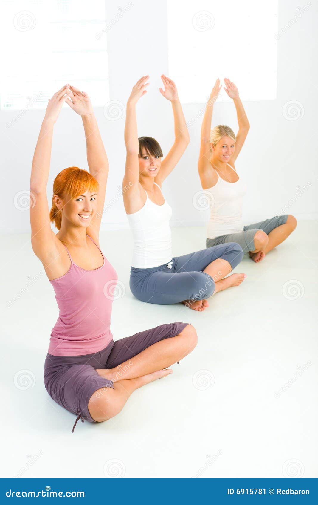 Women doing yoga exercices stock image. Image of adult - 6915781