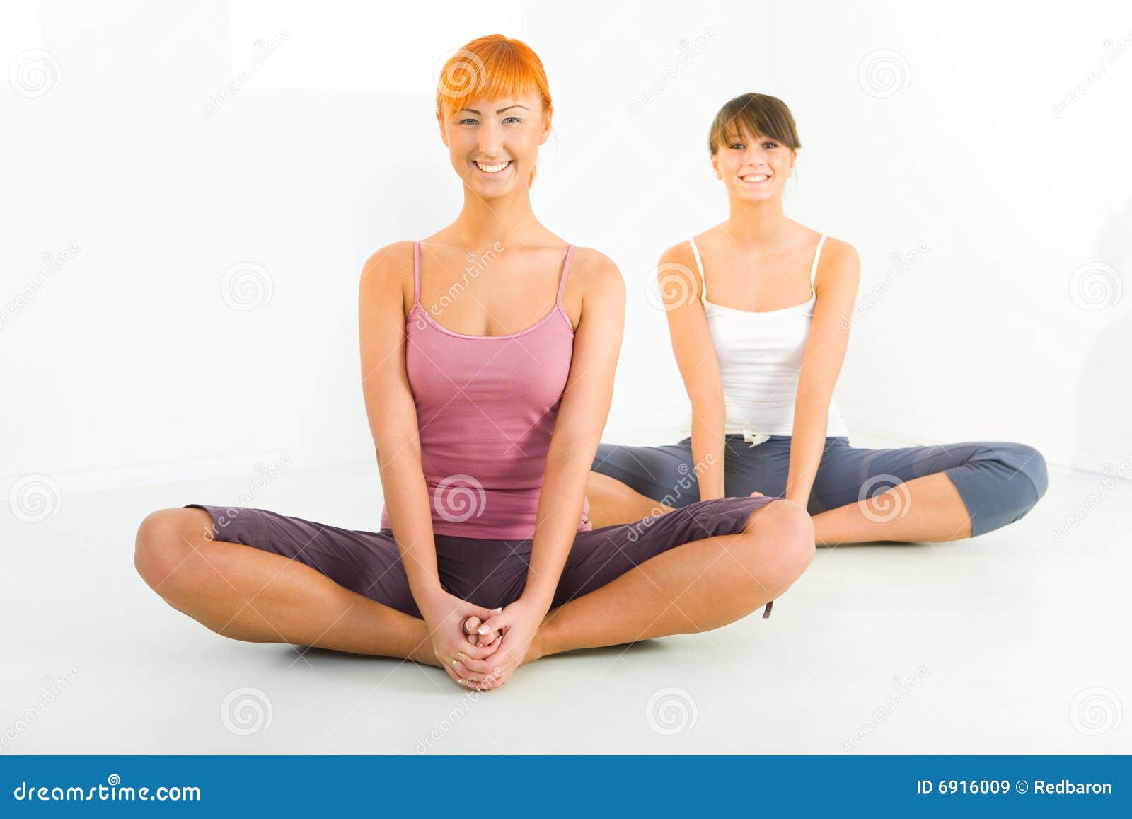 Women doing yoga exercices stock image. Image of front - 6916009