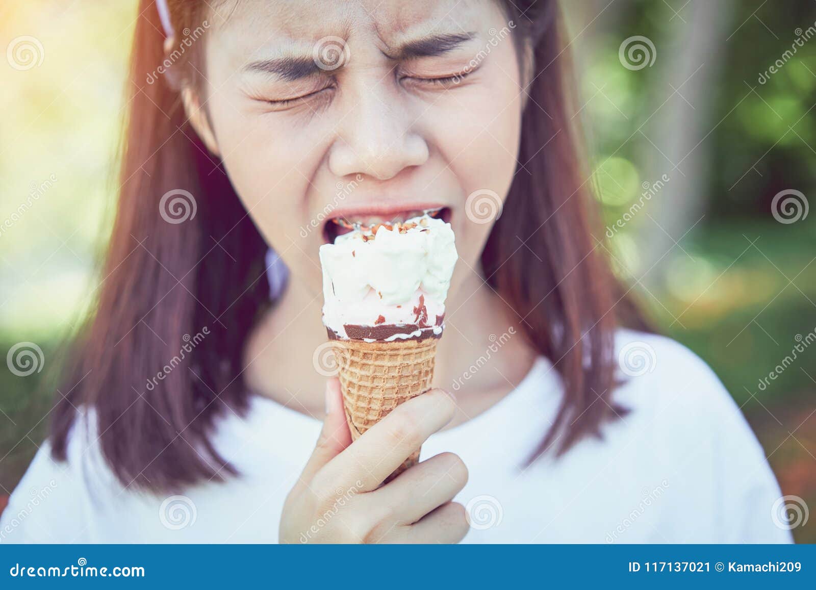 Women Eat Ice Cream and Have a Toothache because Cold. Stock Image ...