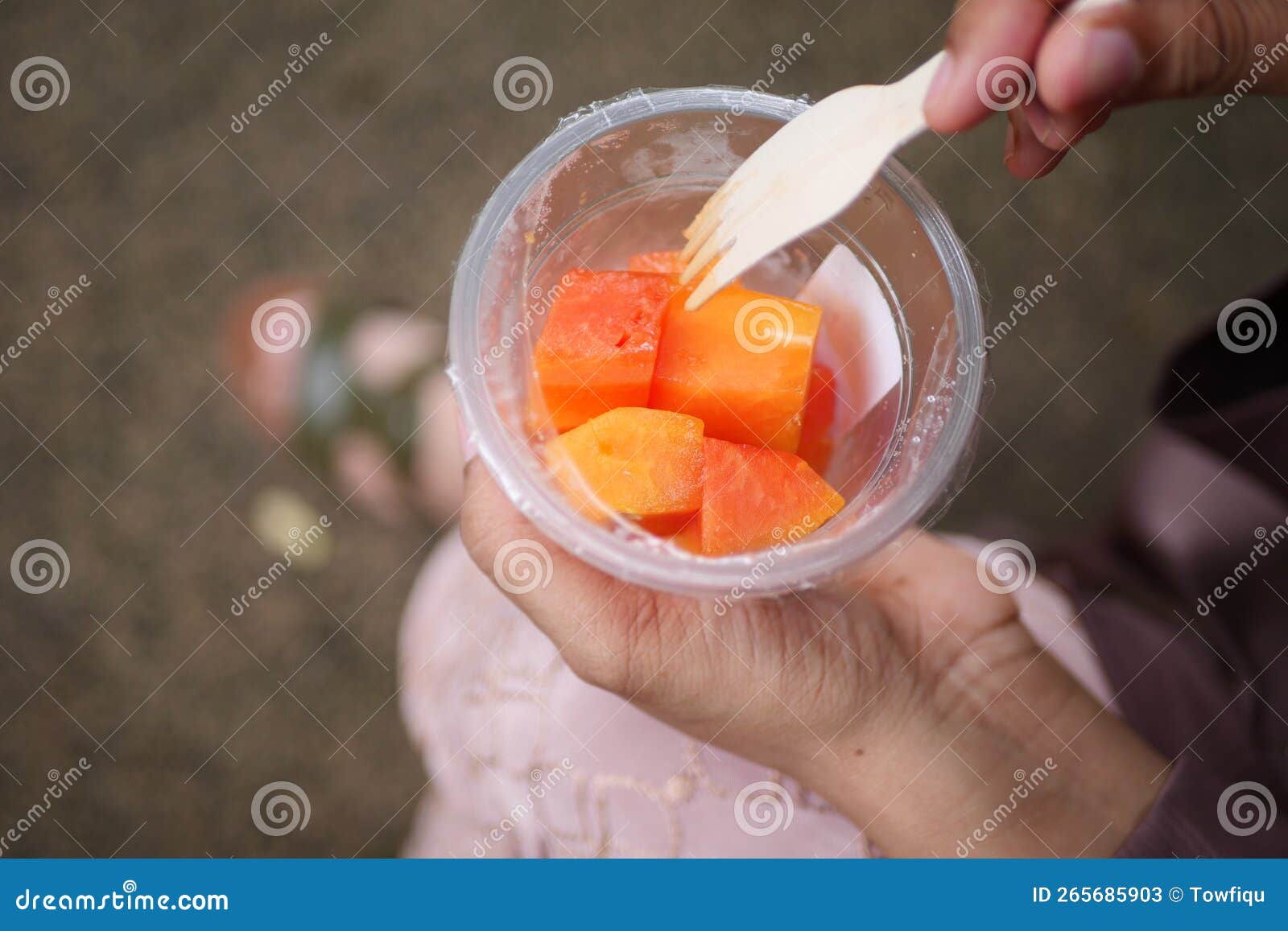 Women Eating Papaya and Grape from a Plastic Take Away Container Stock ...