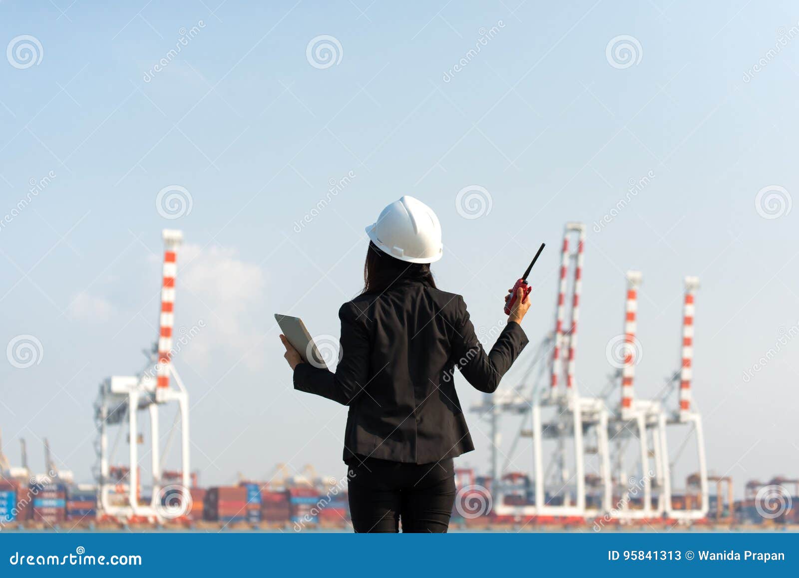 The Women Engineer Holding Radio and Working with Container Cargo ...