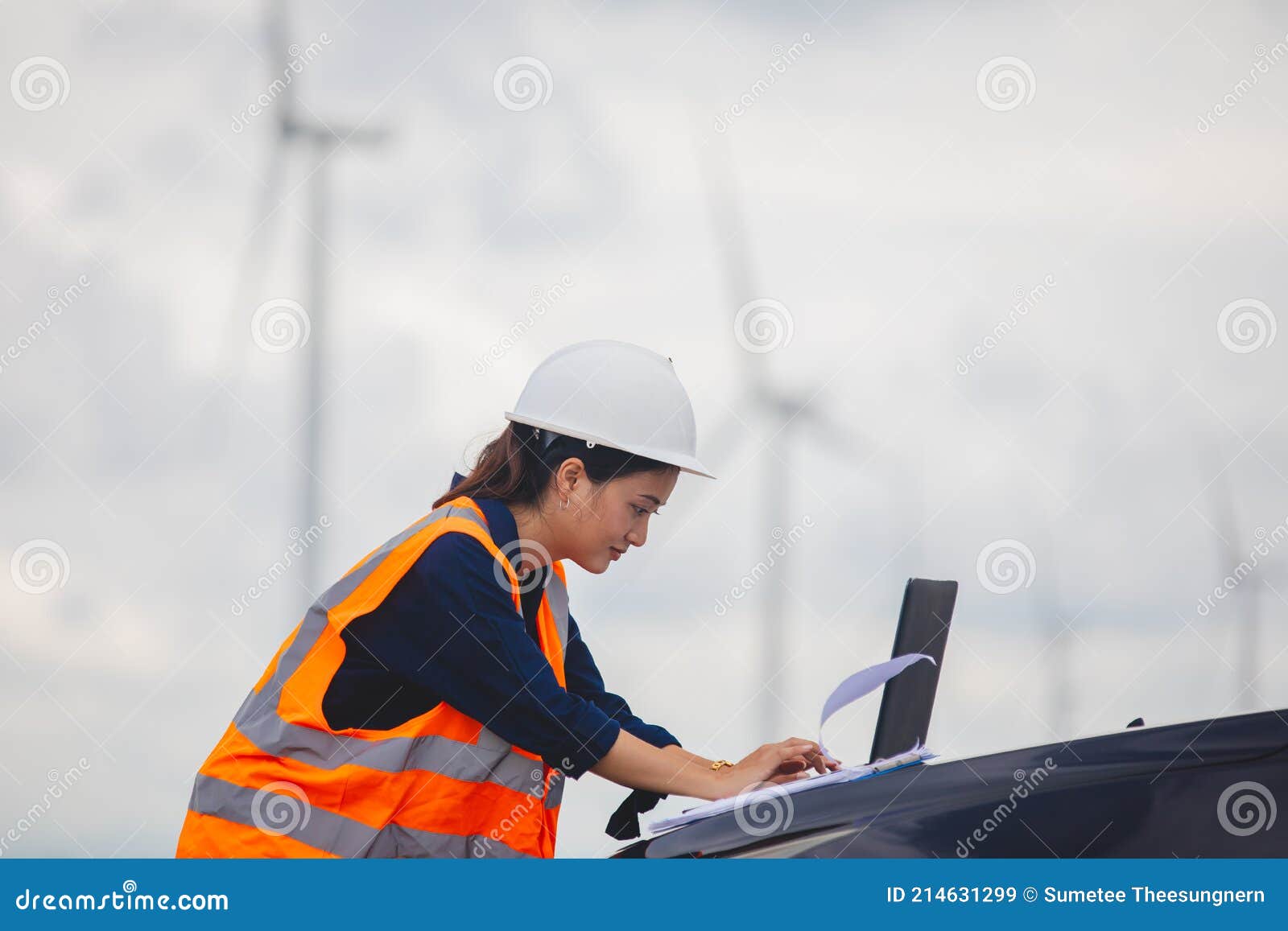 Women Engineer Using Mobile Phone and Laptop for Working on-site at ...