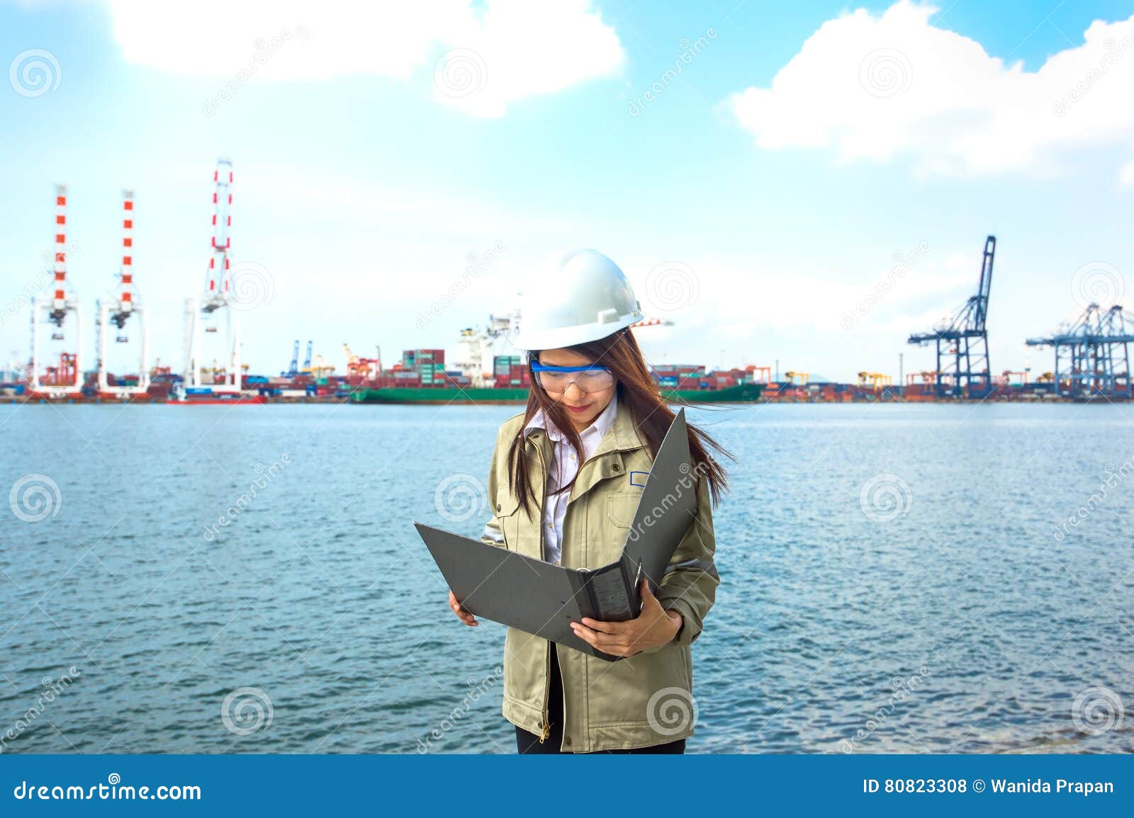 The Women Engineer Working with Container Cargo Freight Ship in ...