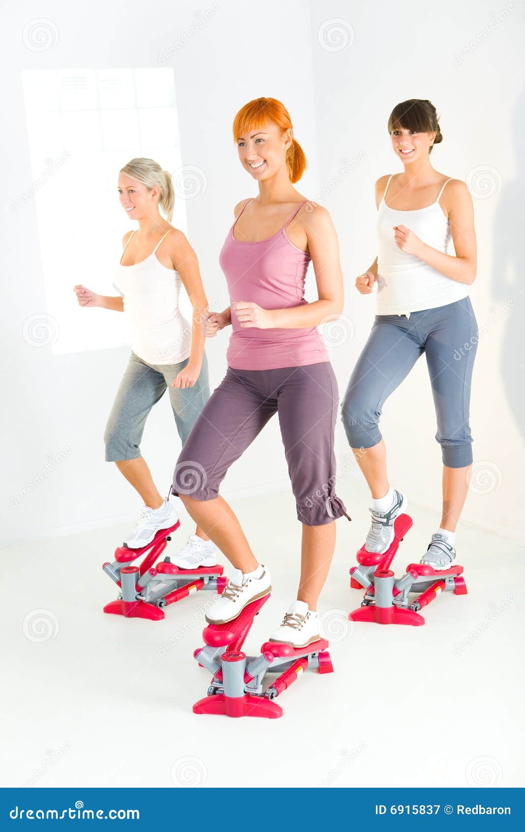 Women Exercising on Stepping Machine Stock Image - Image of active ...