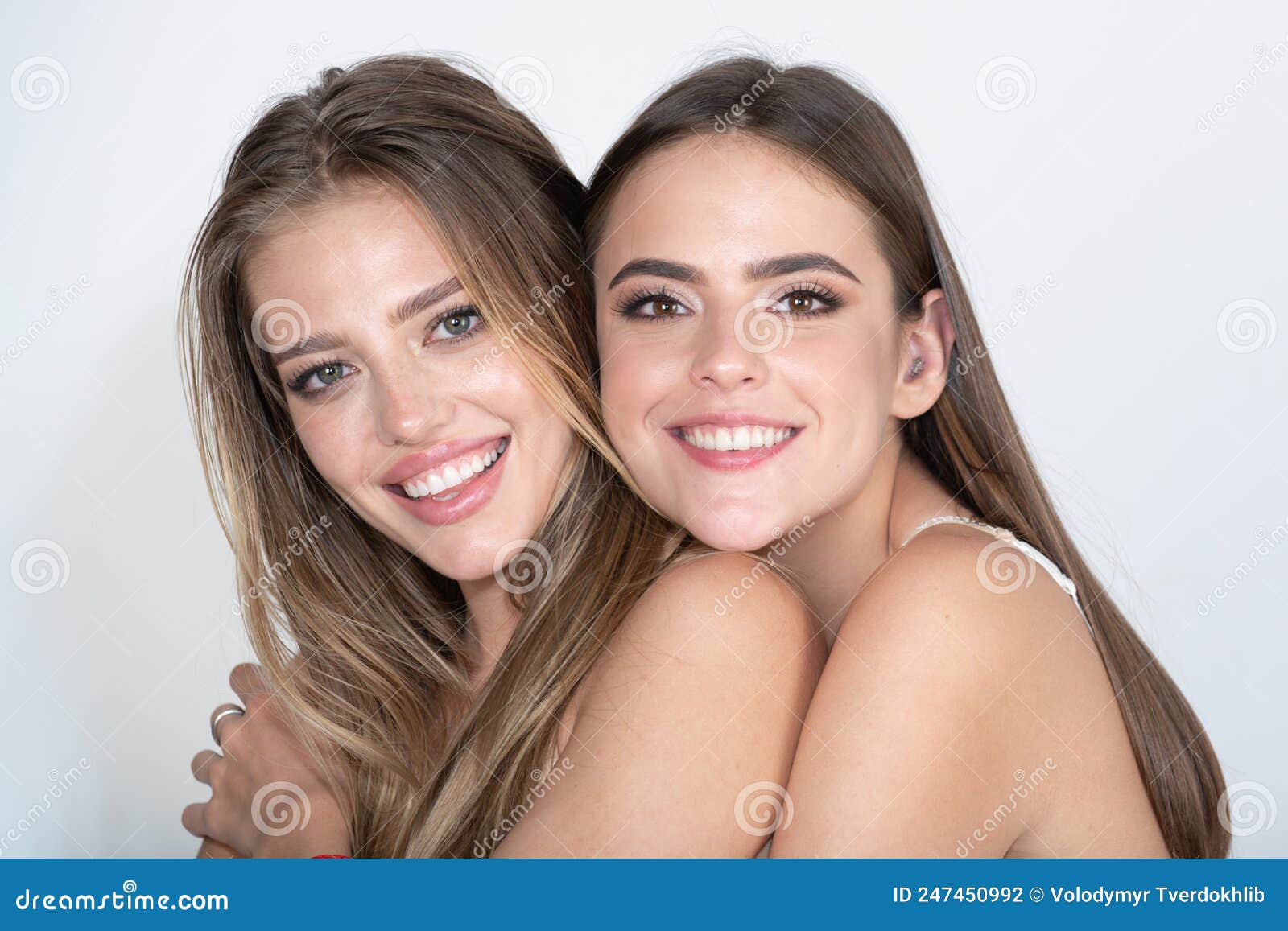 Women Face Of Two Happy Smiling Girls Close Up Beauty Portrait Of