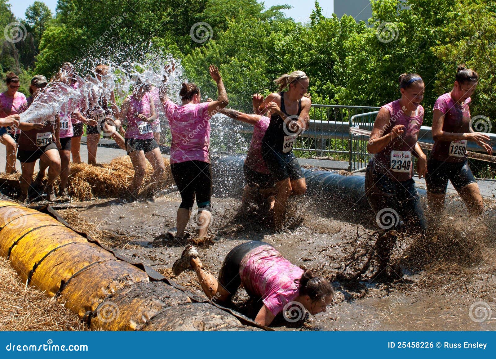 Women Get Sprayed with Fire Hose in Mud Pit Editorial Photo - Image of ...