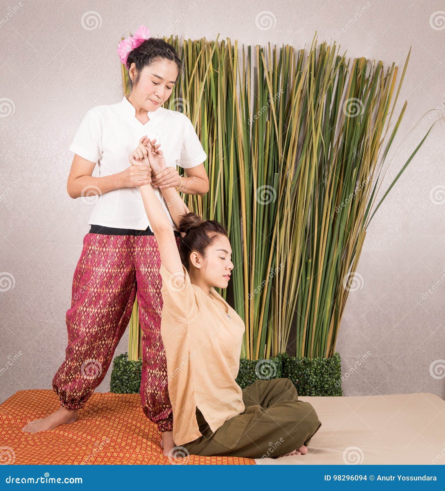 Women is Getting Back Stretching in Thai Massage Stock Photo - Image of ...