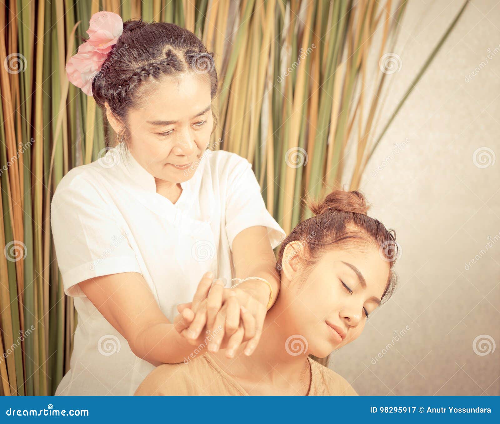 Women Is Getting Shoulder Stretching In Thai Massage Stock Image