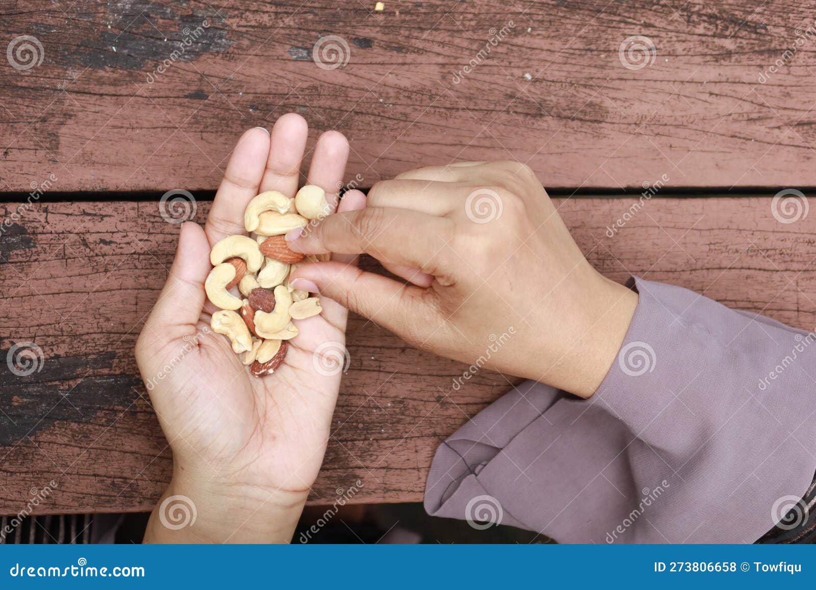 Women hand pick mixed nut stock photo. Image of pieces - 273806658